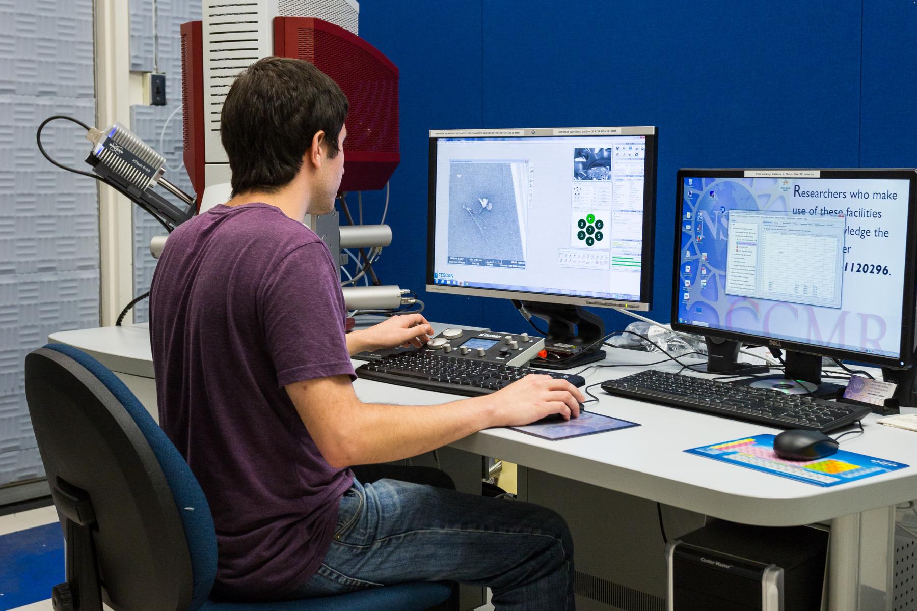 Scientific Image - Scientist Using a Scanning Electron Microscope ...