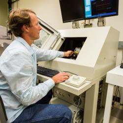 Scientific Image - Scientist Using an Atomic Force Microscope | NISE Network